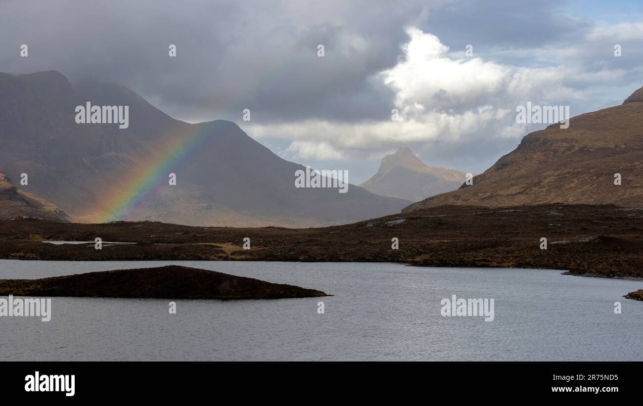 Scottish Highlands with rainbow Stock Photo - Alamy