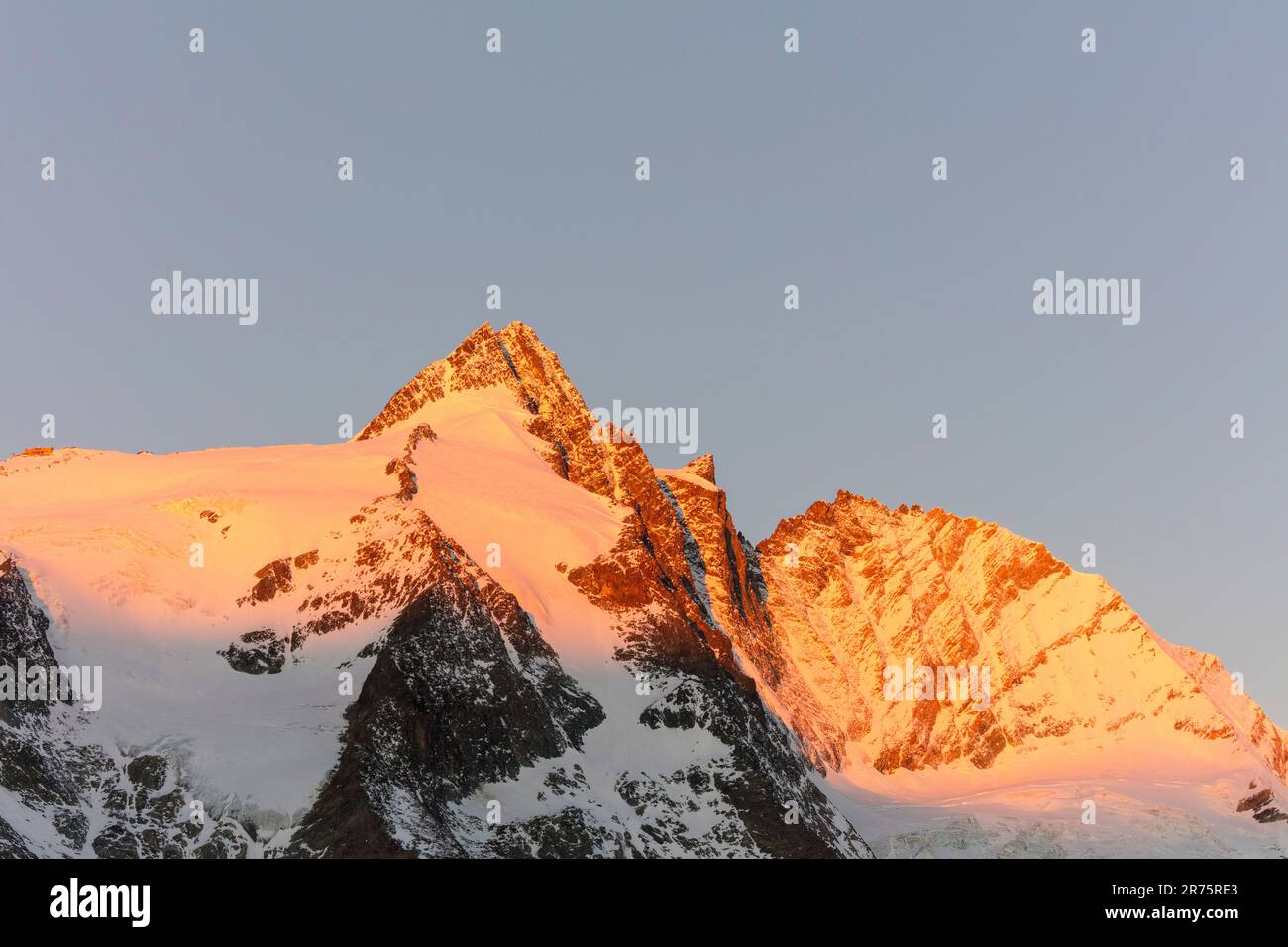 Großglockner summit at sunrise, alpenglow Stock Photo - Alamy