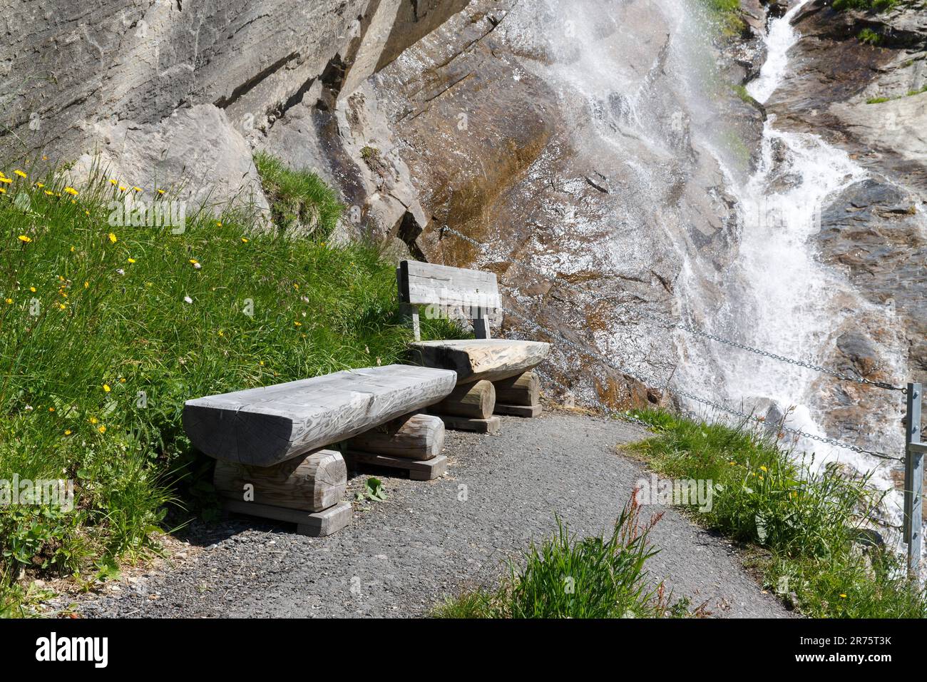 Fensterbach waterfall on the Grossglockner High Alpine Road with bench ...