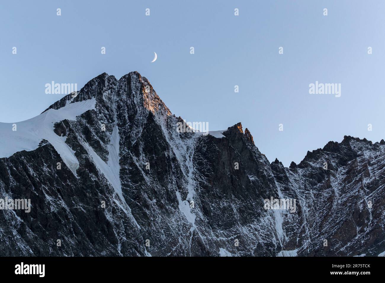 Großglockner north side, after sunset with small crescent moon Stock ...