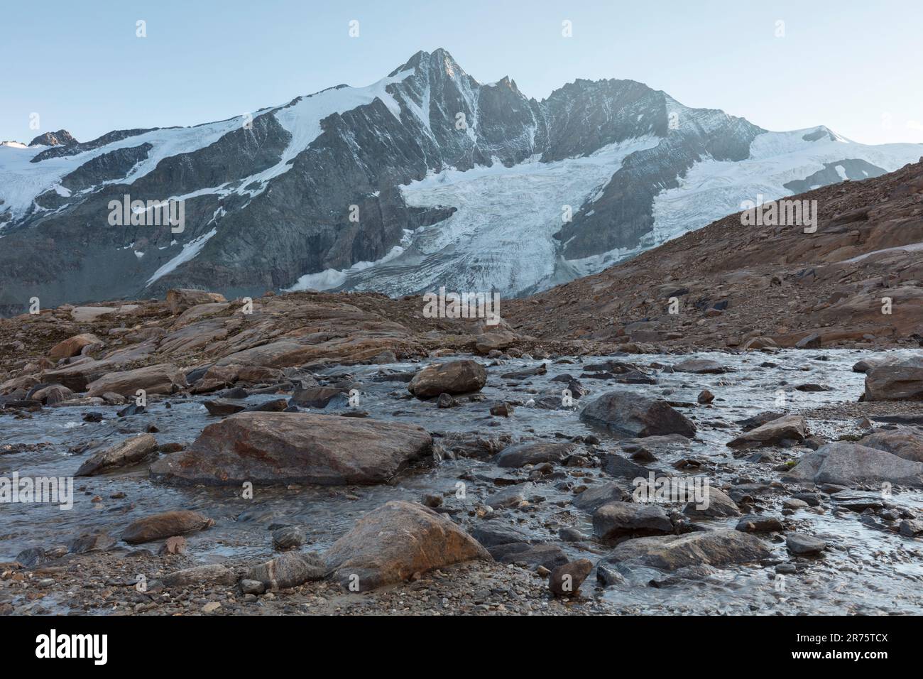 Waterfall angle with Großglockner, north side of the peak, creek Stock ...