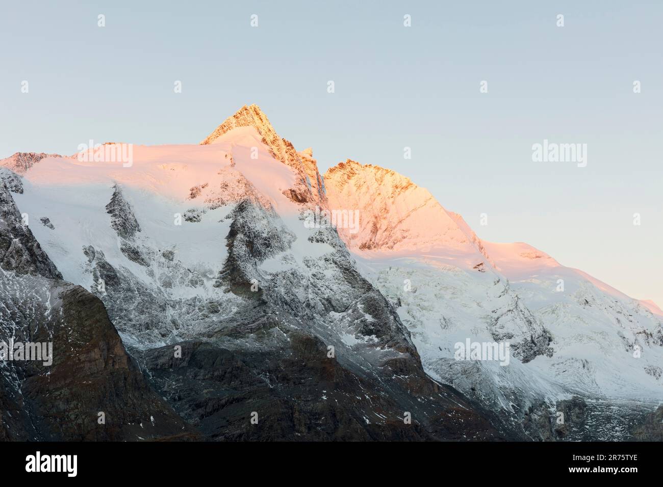 Großglockner summit at sunrise, morning red Stock Photo - Alamy