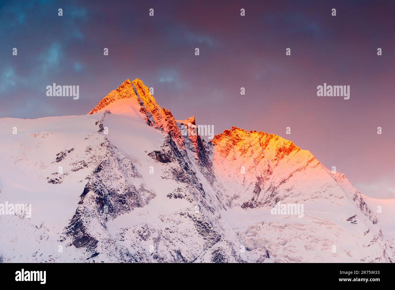 fresh snowy Großglockner summit at sunrise, alpenglow Stock Photo - Alamy