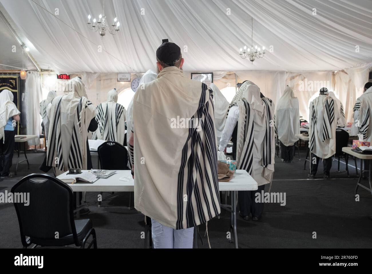 Anonymous orthodox Jewish worshipers at morning services wearing prayer ...