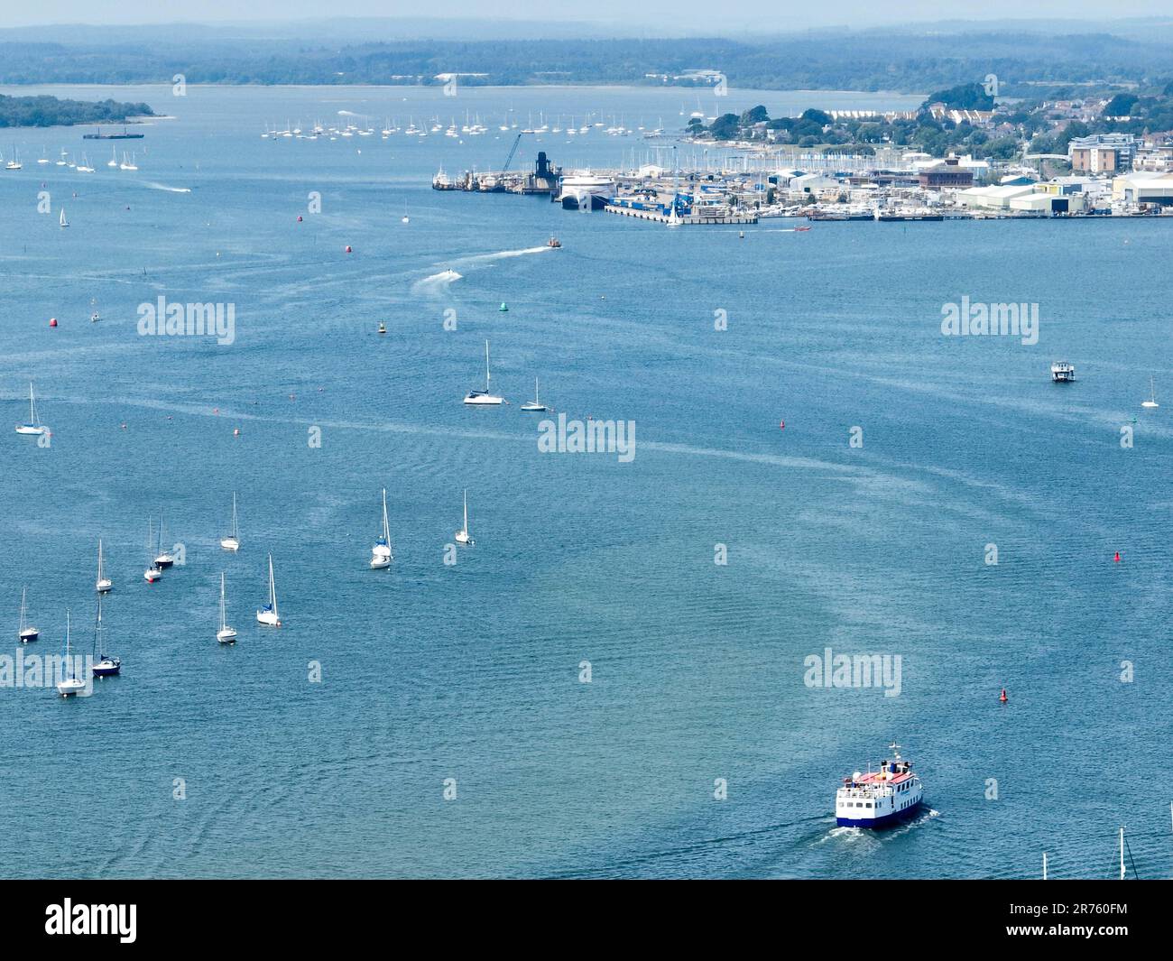 An aerial picture of Poole Harbour with a sightseeing boat crossing the ...