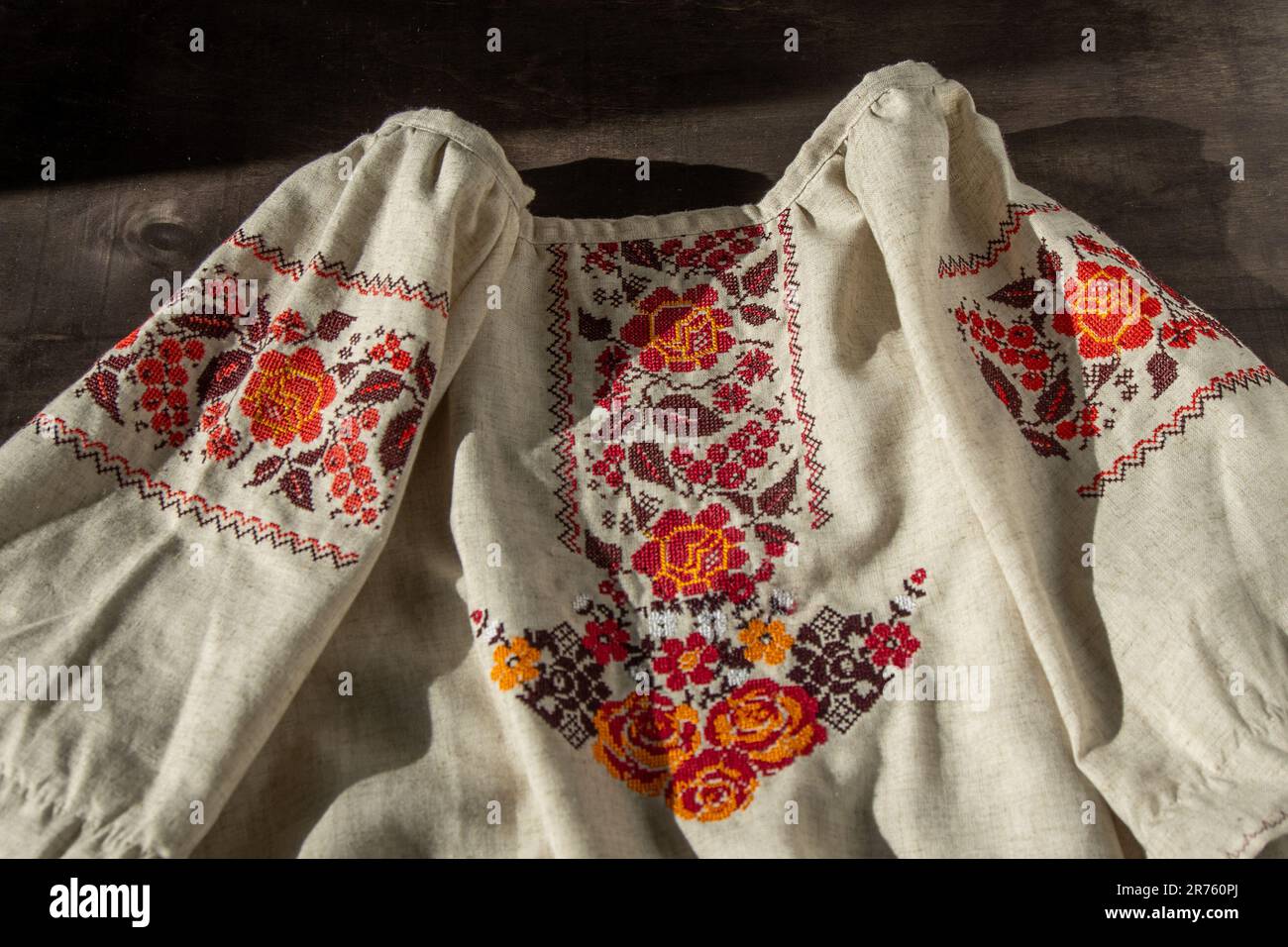 Ukrainian clothes embroidered shirt. Red orange and black threads ...