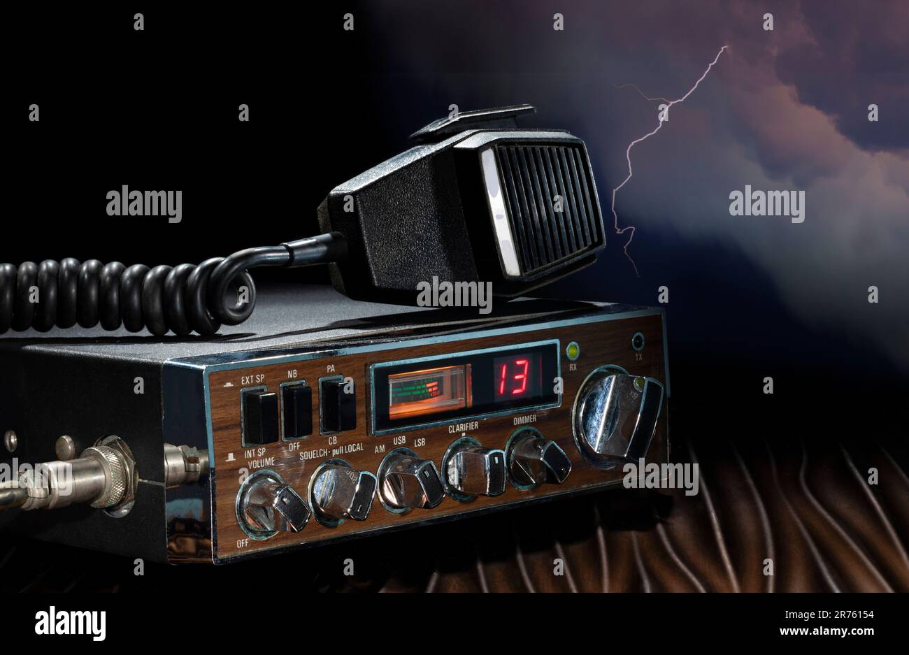 Channel 13 on a CB radio with lightning behind Stock Photo - Alamy