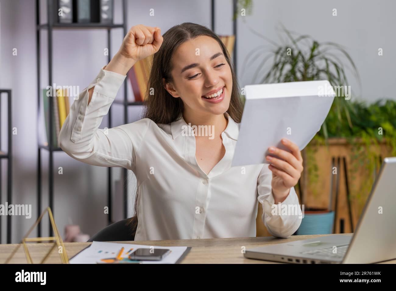 Caucasian business woman open envelope letter reading it. Career growth ...