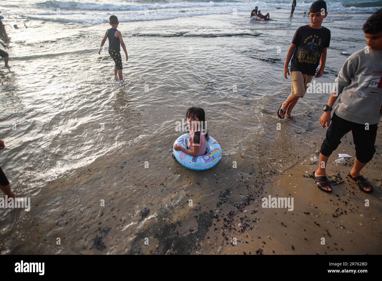 Gaza, Palestine. 13th June, 2023. Kids seen having fun in water on the ...