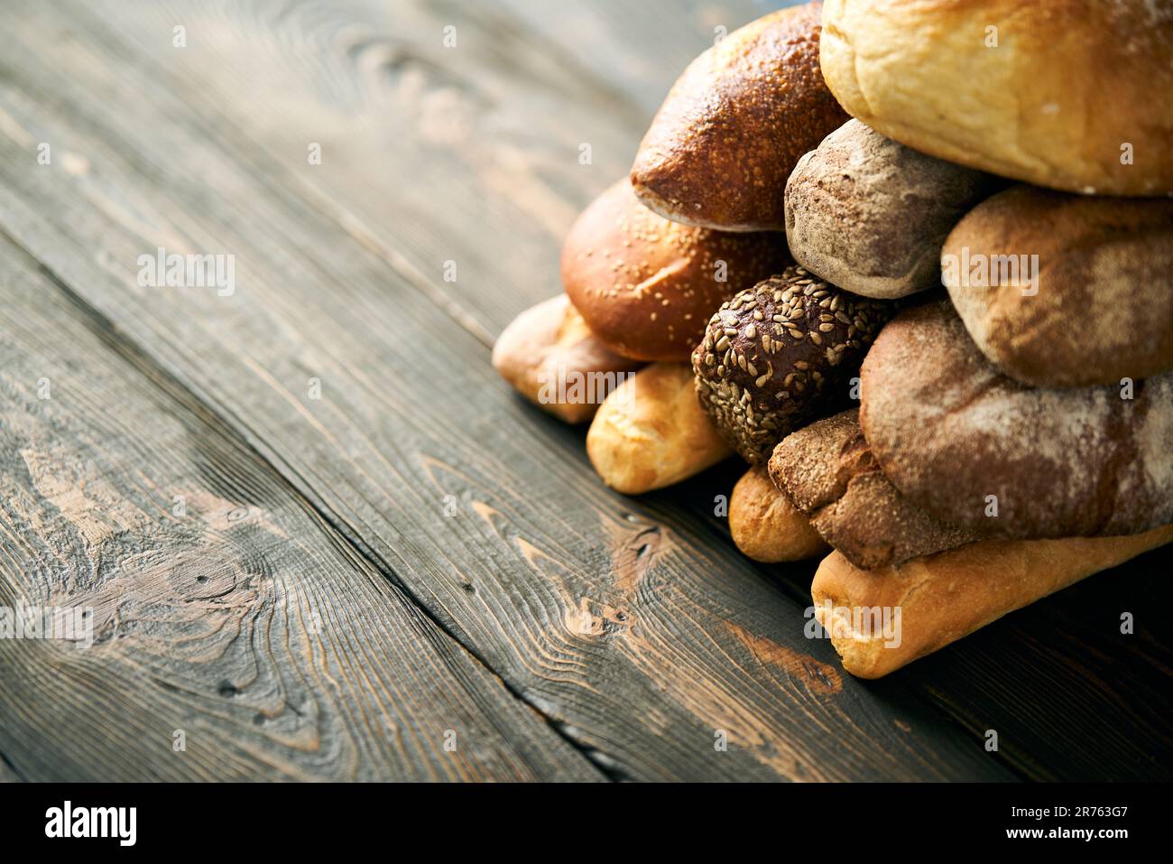 Different types of bread loaves close up with copy space. Bakery, food ...