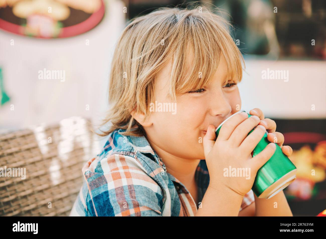 Little kid boy drinking soda in cafe on a very hot day Stock Photo - Alamy