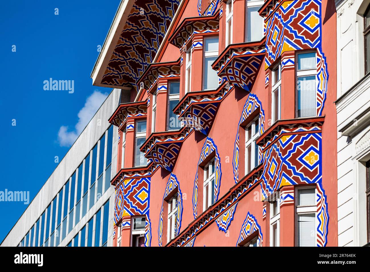 An ancient and famous red-brick cathedral with a unique window facade ...