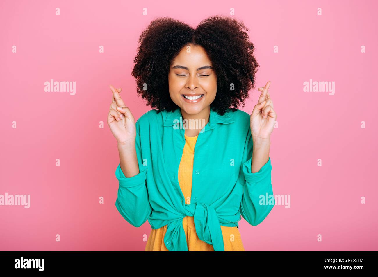 Nervous pretty brazilian or african american woman in green shirt ...