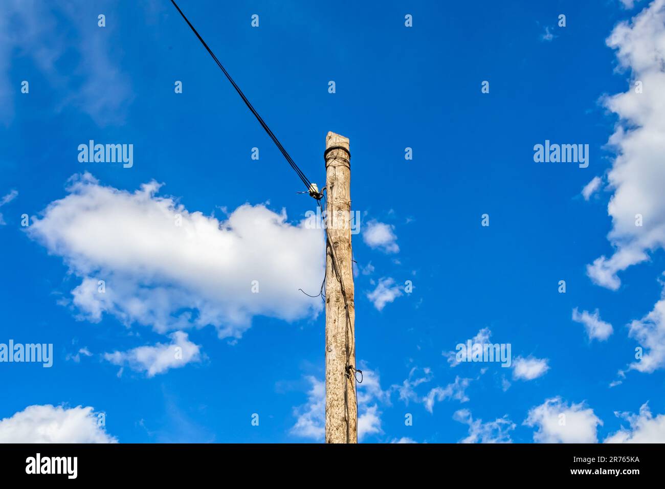 Power electric pole with line wire on colored background close up ...