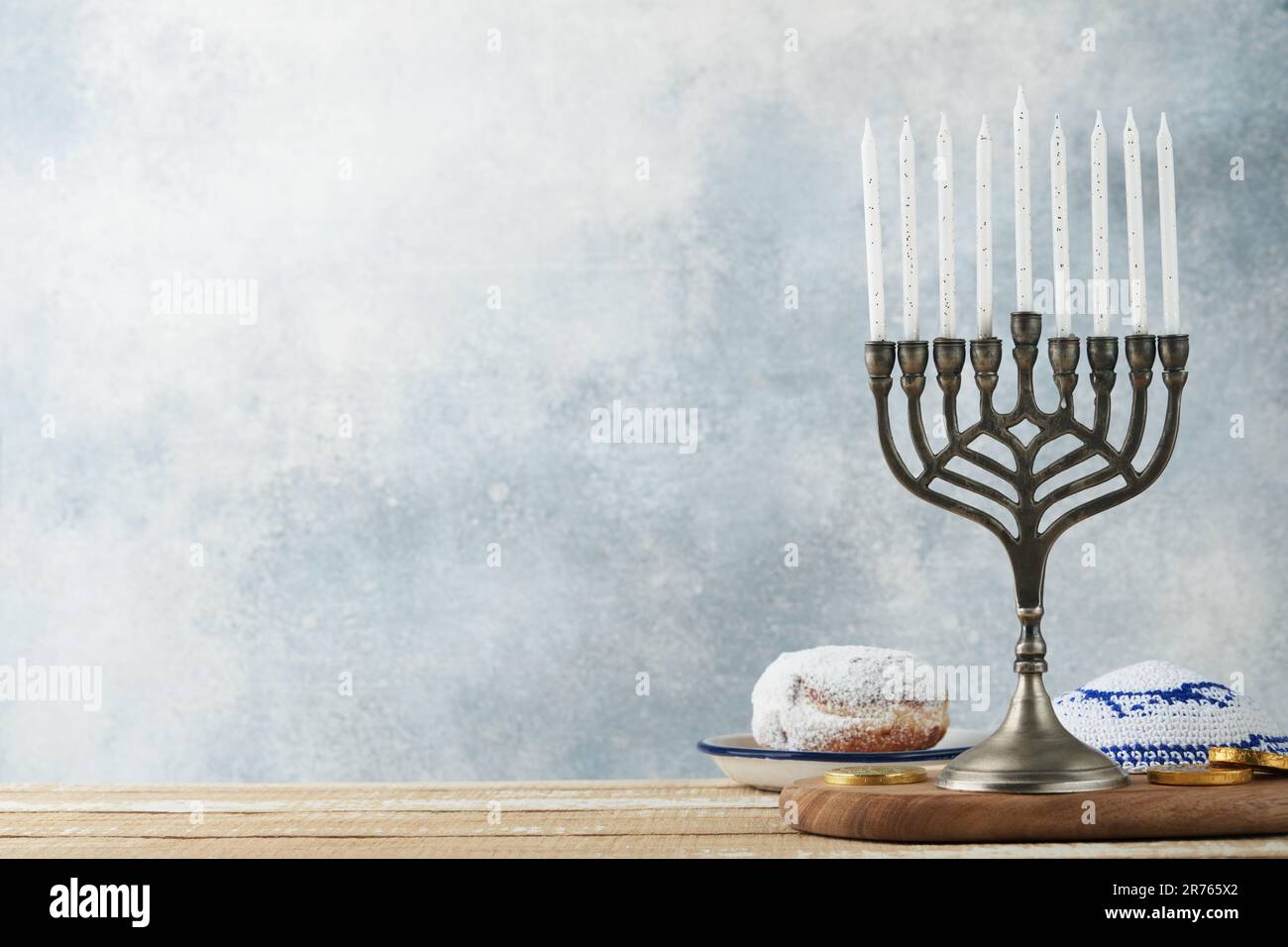 Happy Hanukkah. Hanukkah old Menorah against background of the Israeli ...