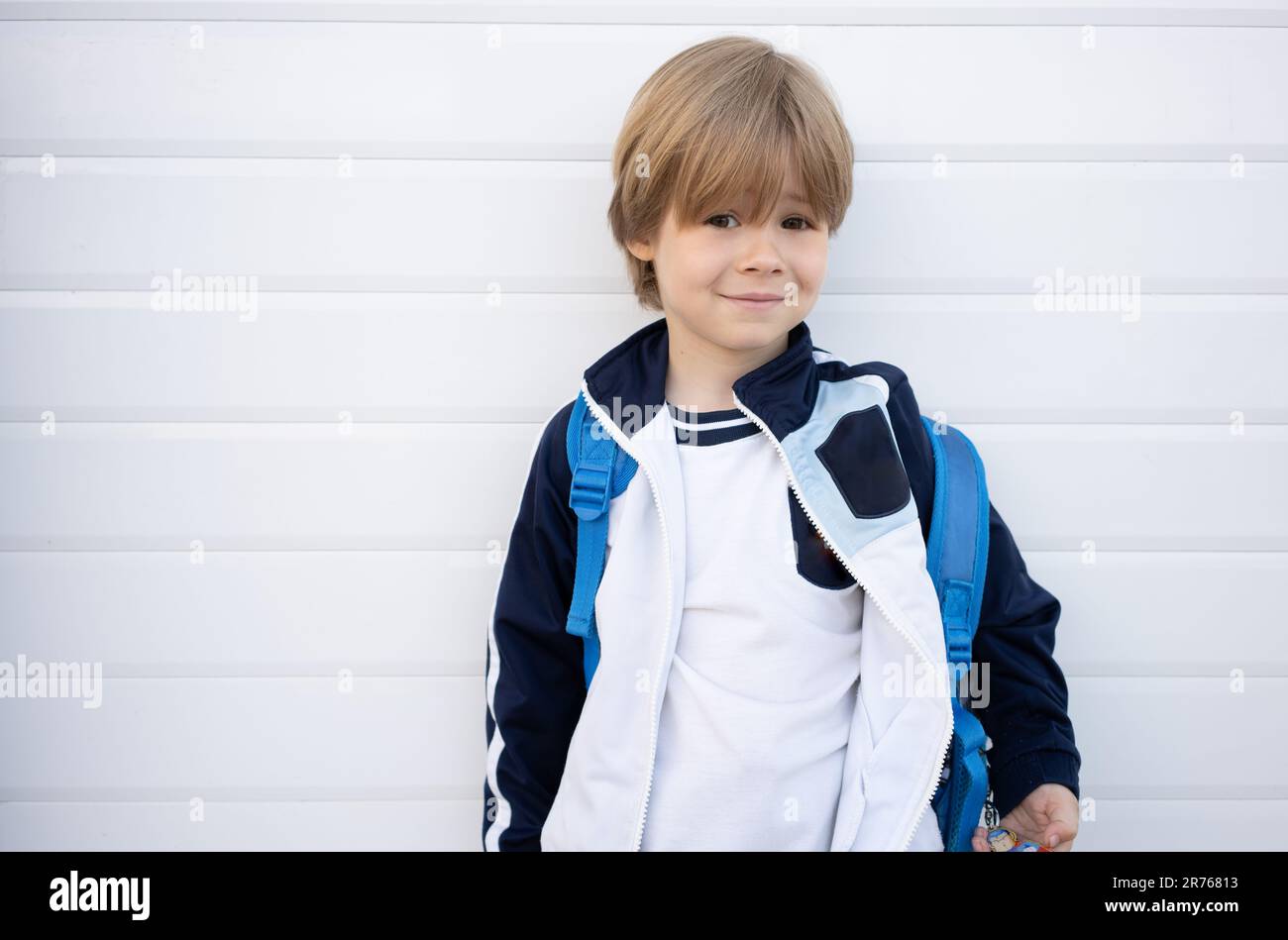 Portrait of 4 years old boy looking at camera with beautiful brown eyes ...