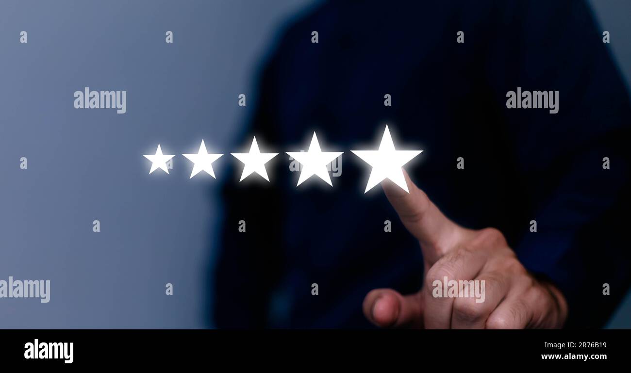 Businessman hand touching five star symbol to increase rating of ...