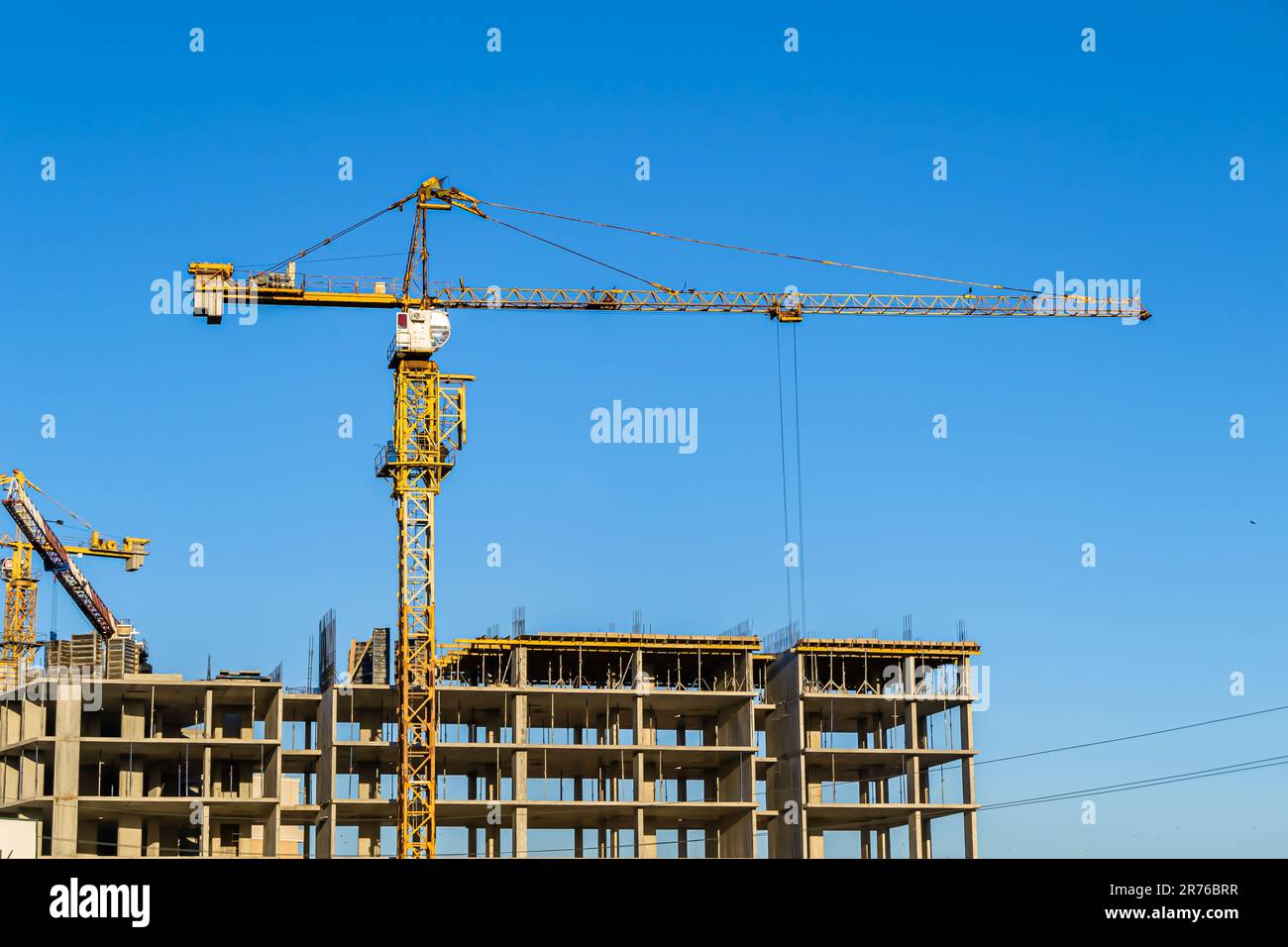 Big steel crane on construction site of residential building, photo ...