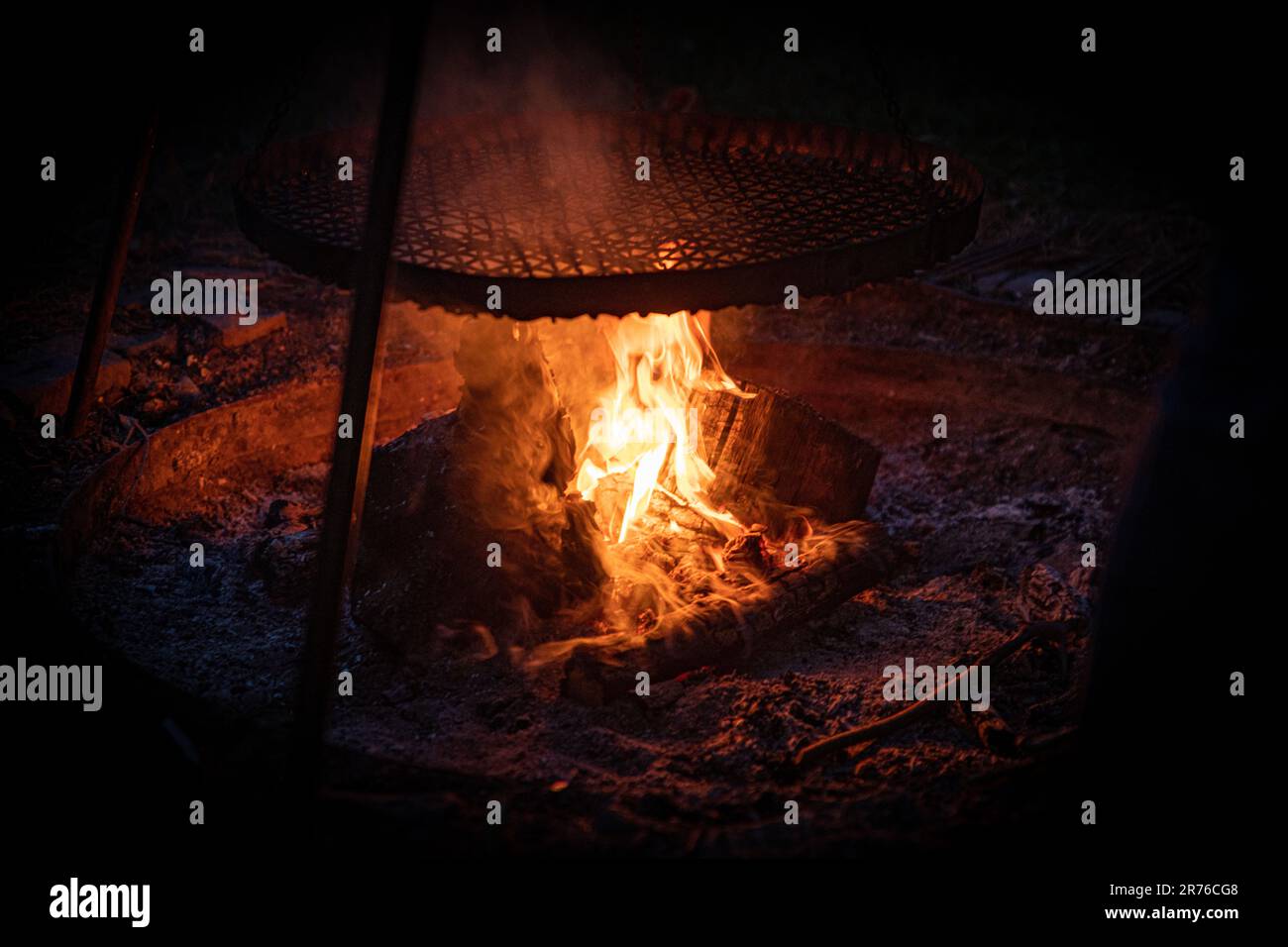 Bright burning fire with embers in front of black background Stock ...