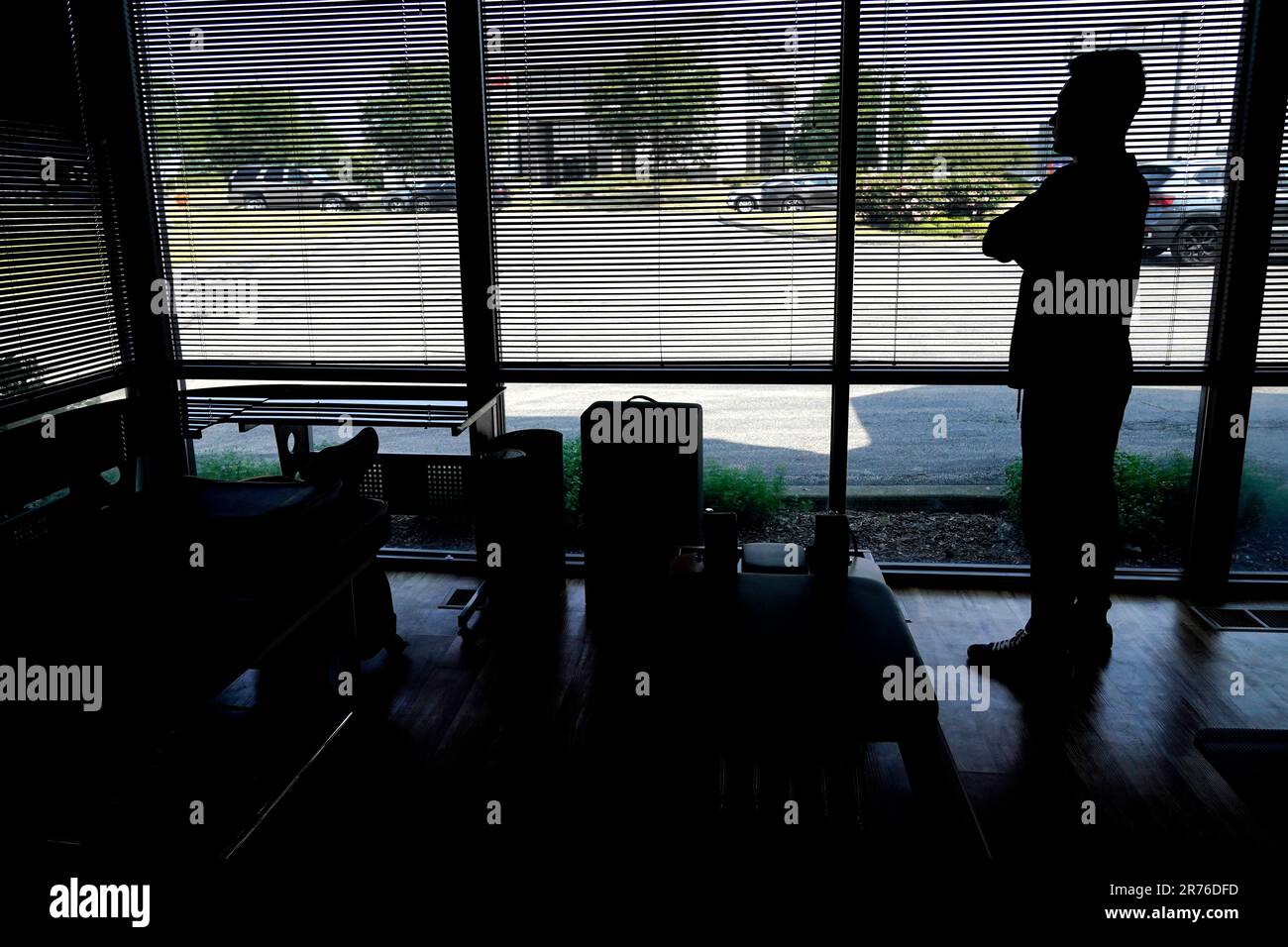 Dr. Jaesun Ma D.C., looks out from his office at Naperville Wellness ...