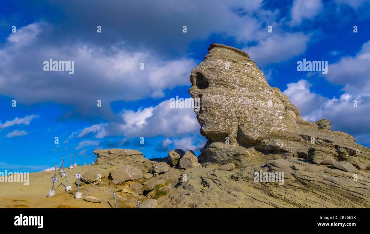 The Sphinx stony landmark in Bucegi national park against a blue sky ...
