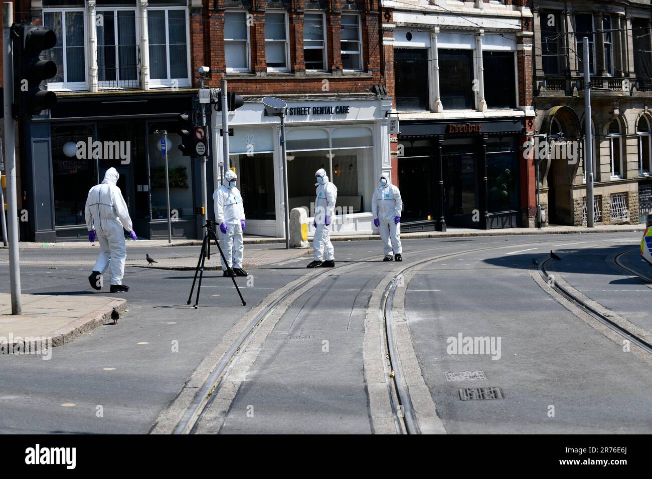 Forensic police officers search the local area. Nottingham van attack ...