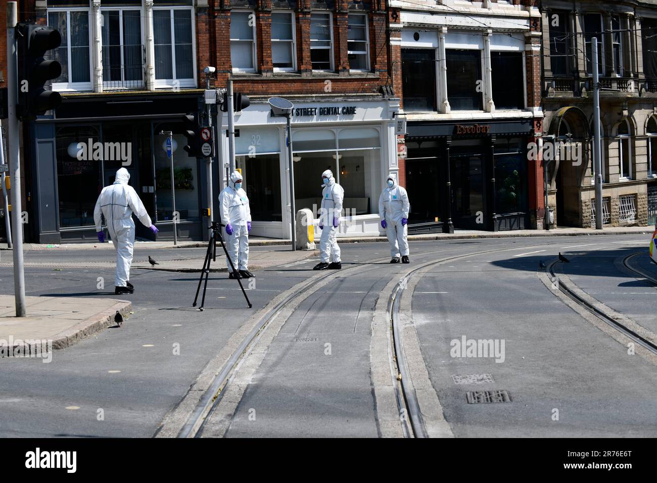 Forensic police officers search the local area. Nottingham van attack ...