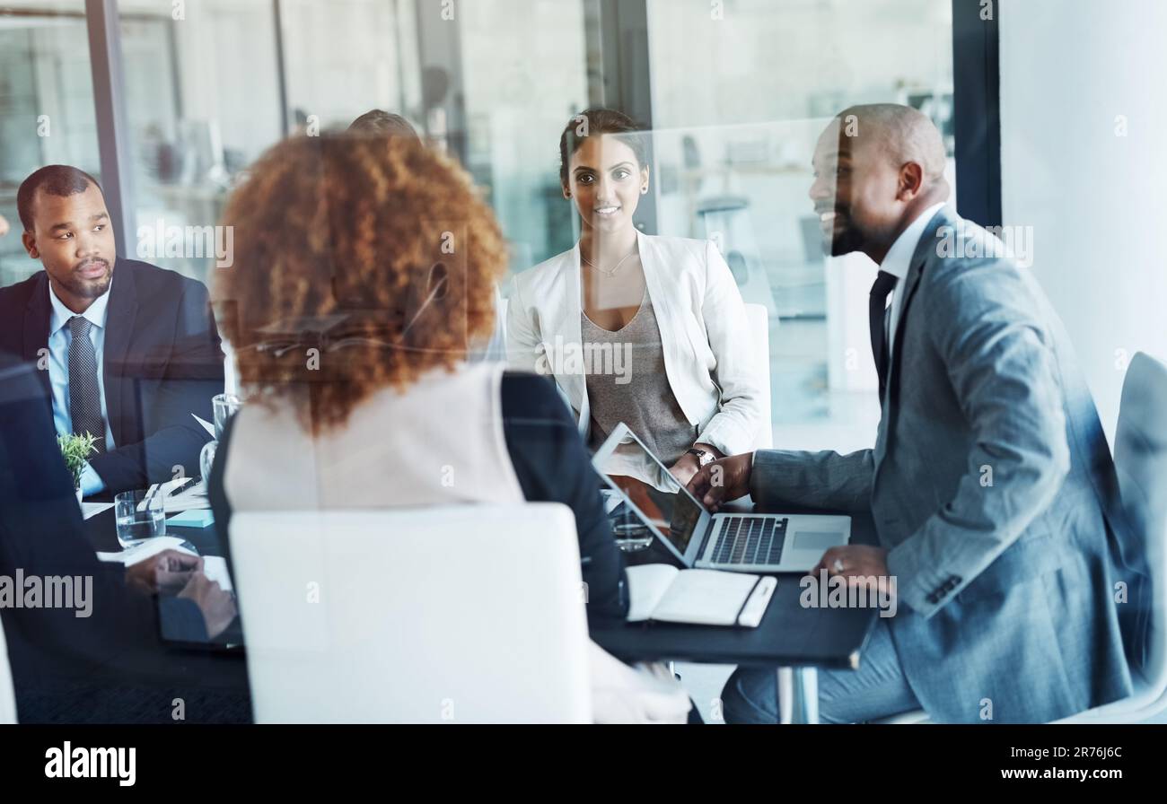 Staying informed and aligned on business goals. a team of professionals ...