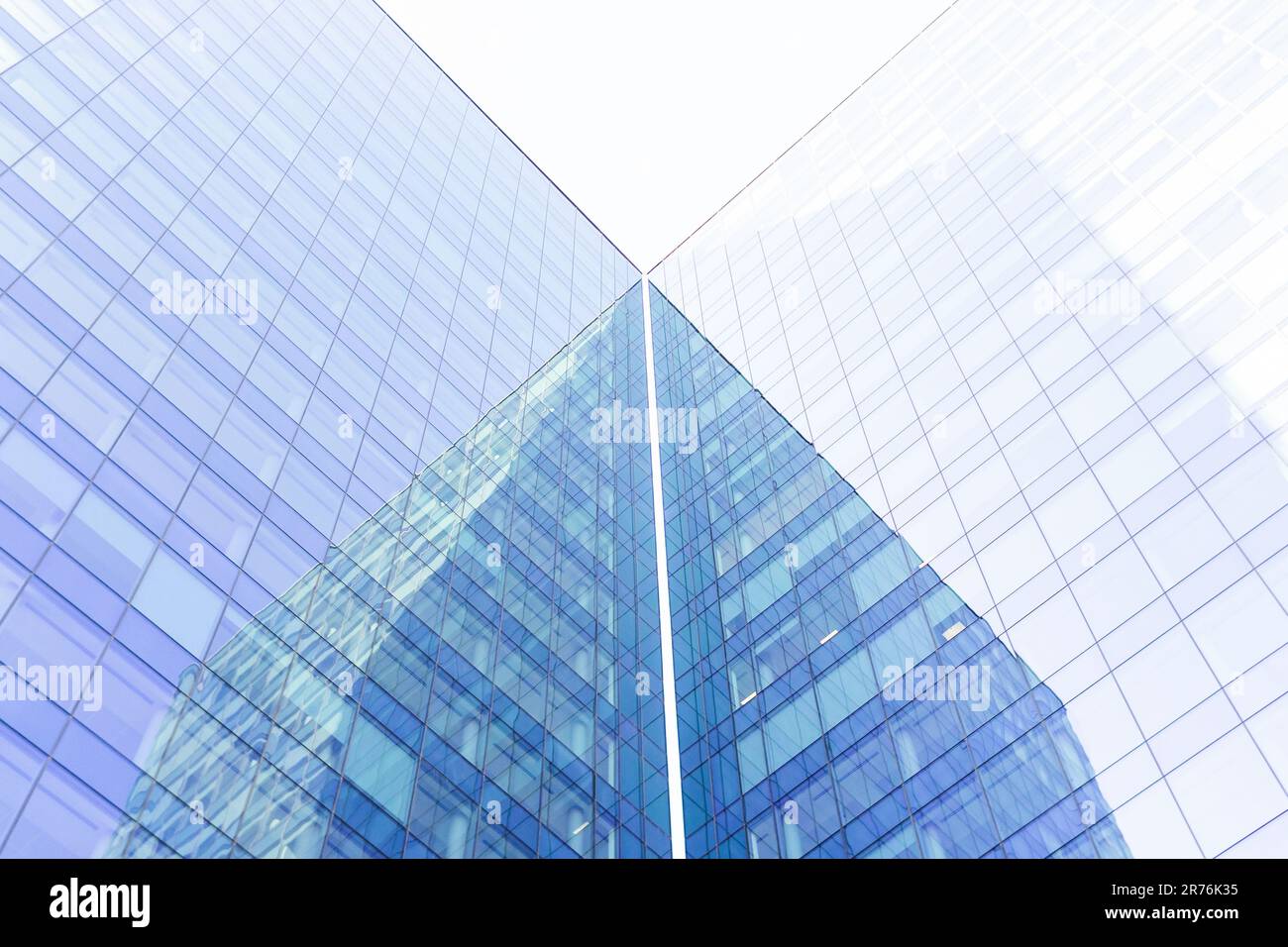 From below of contemporary high rise building with glass mirrored ...