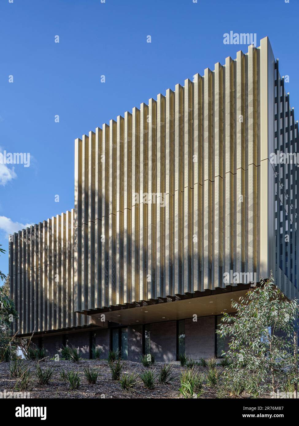 Western elevation with perforated metal facade. Australian National University Research School ...