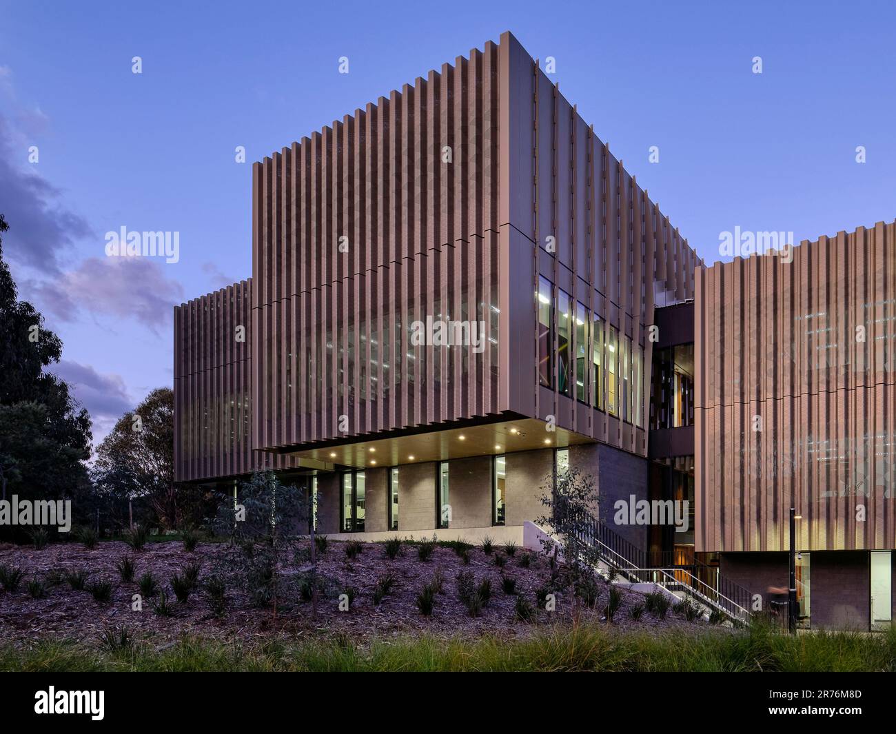 Western elevation with perforated metal facade. Australian National University Research School ...