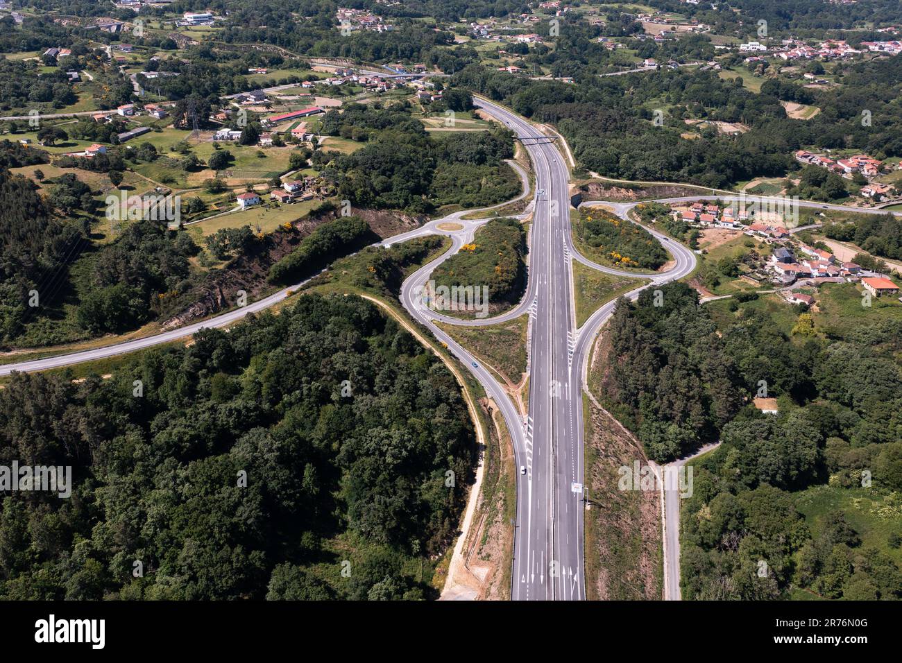From above aerial view of motorway infrastructure development with ...