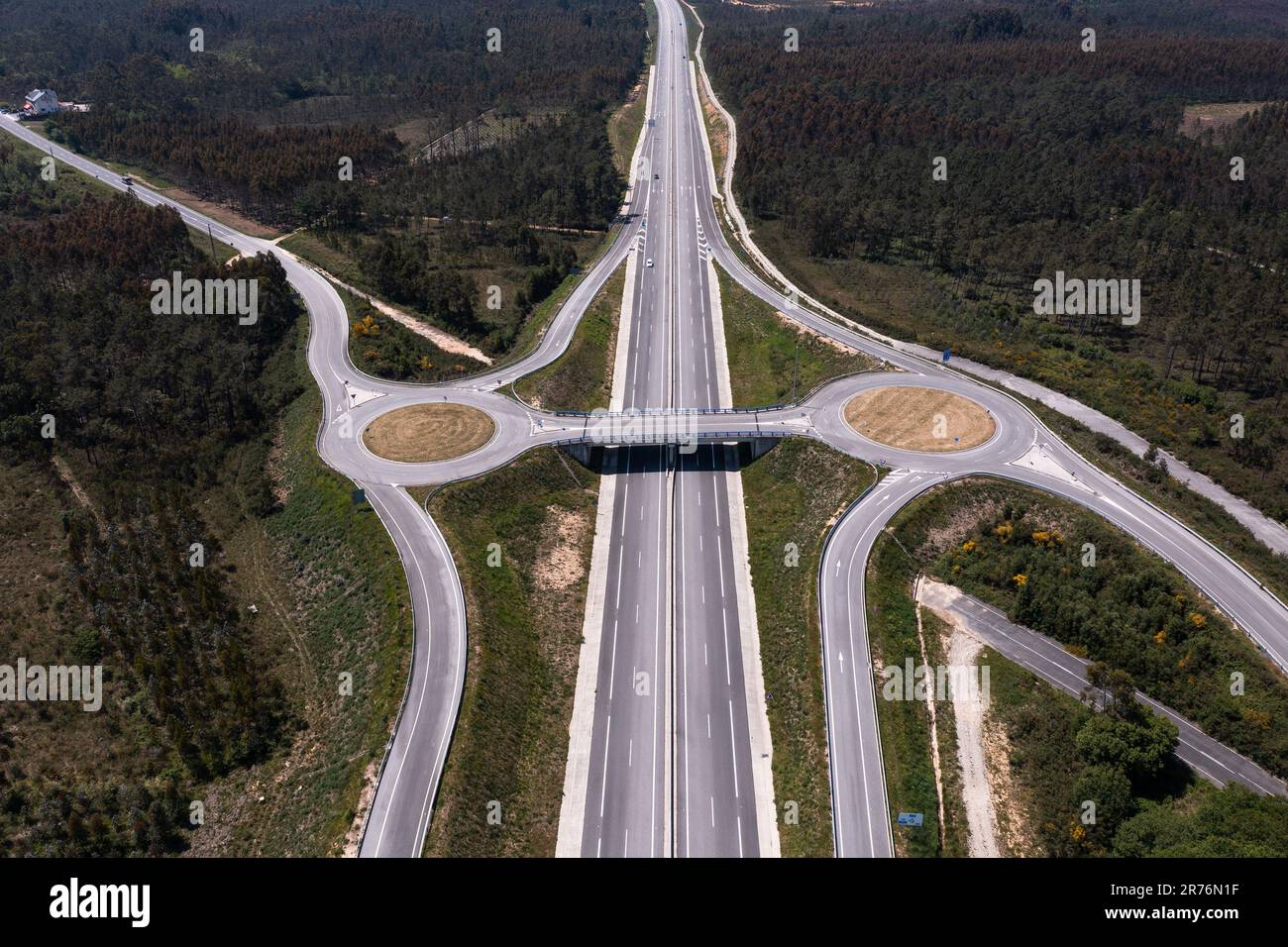High angle aerial view of exit points from two roundabouts linked by a ...