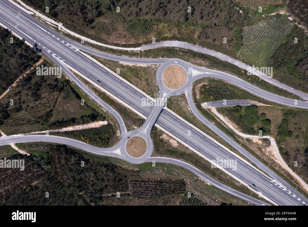 From above aerial view of exit points from two roundabouts linked by a ...