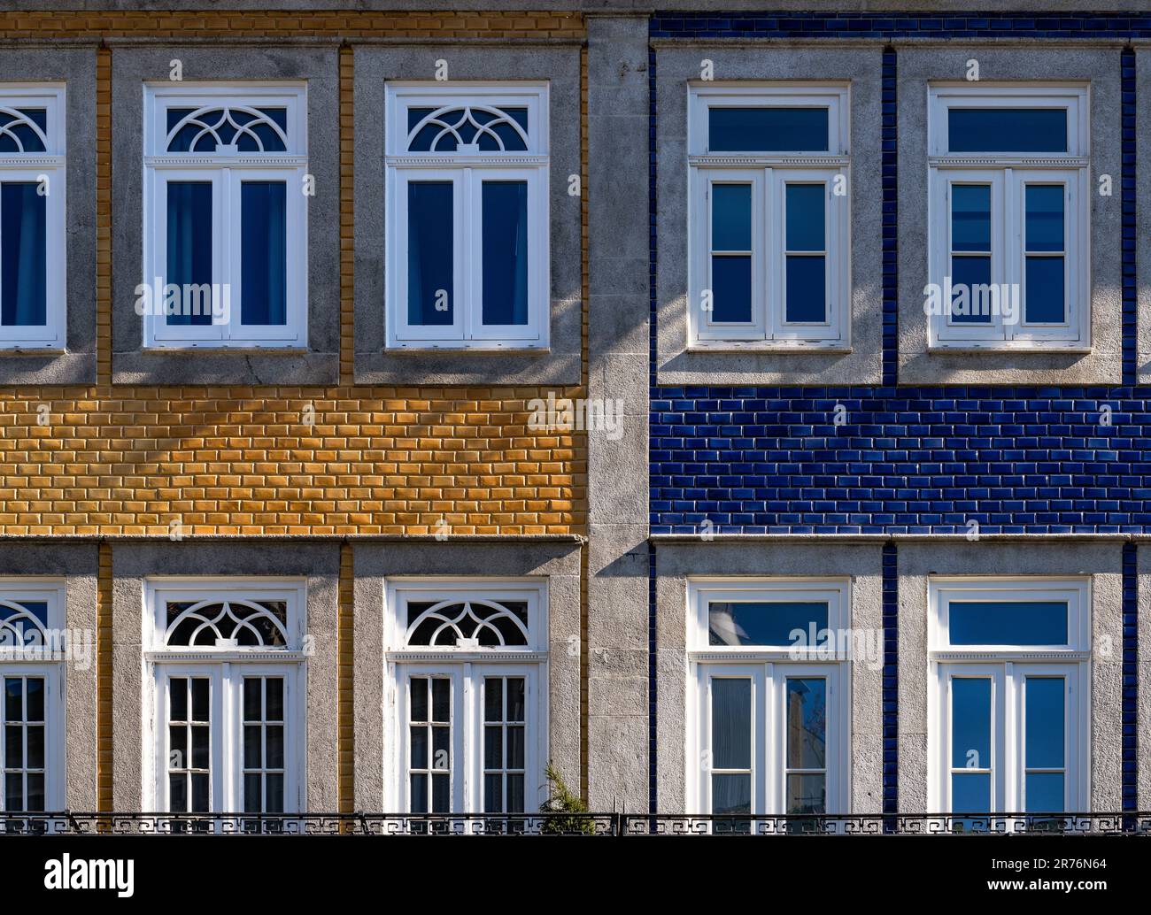 Exterior design of aged residential building with yellow and blue brick ...