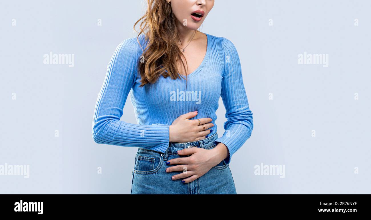 Woman touching his stomach. Stomach pain and others stomach disease ...