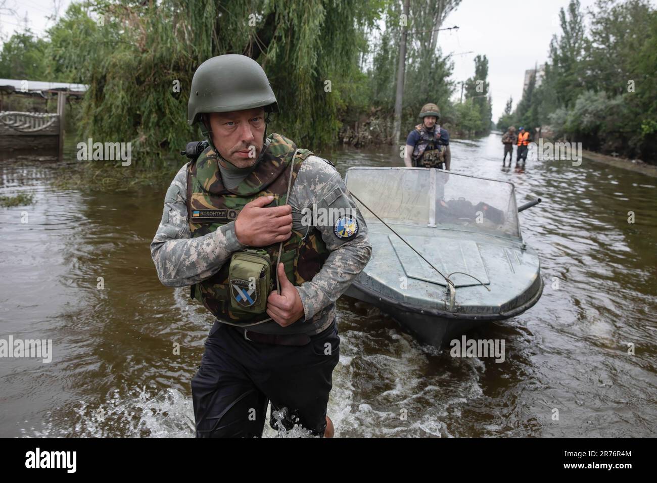 Volunteers actively helping to rescue local residents. The explosion of ...