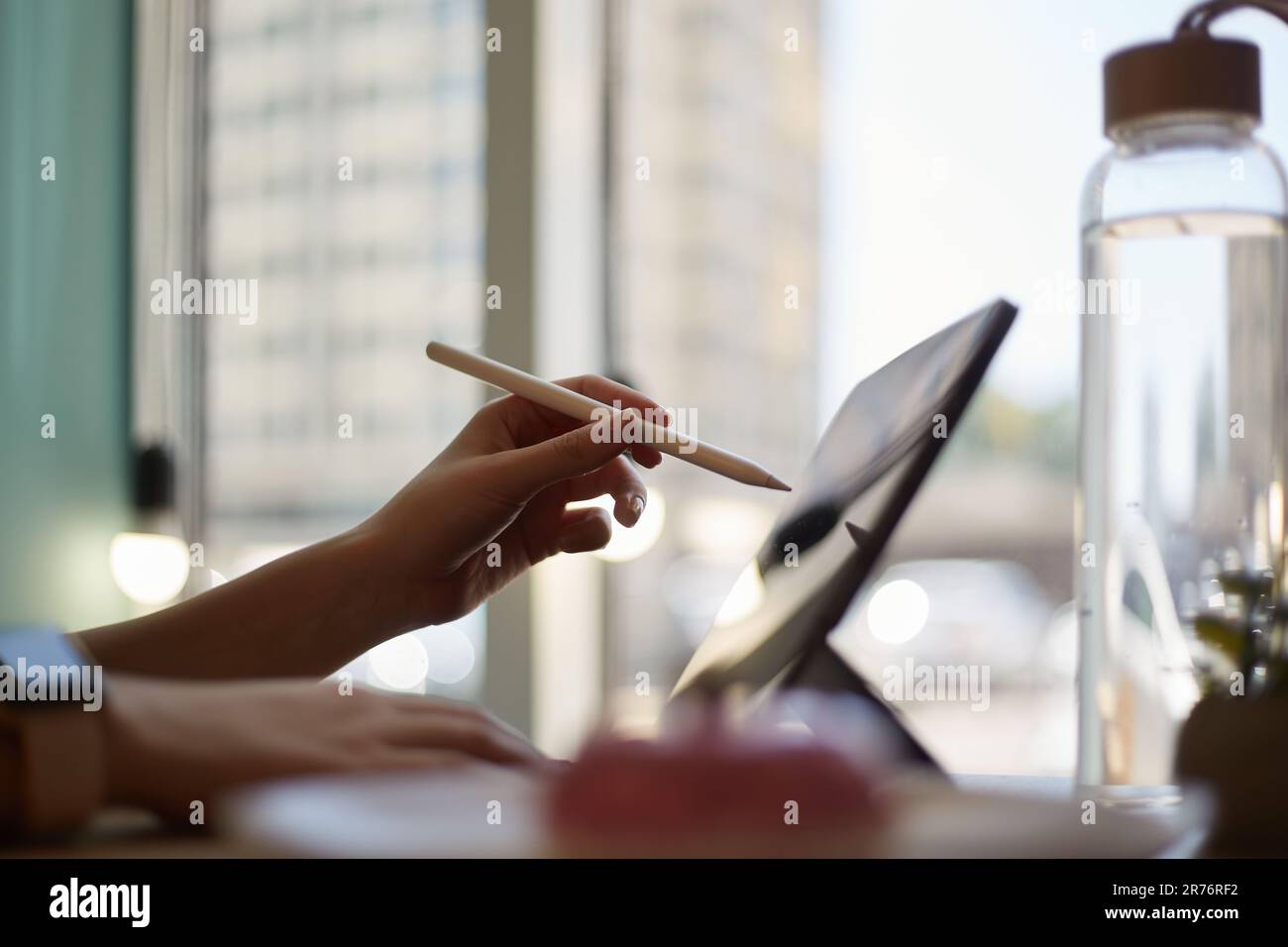 Graphic designer making a new digital sketch with a stylus pen ...