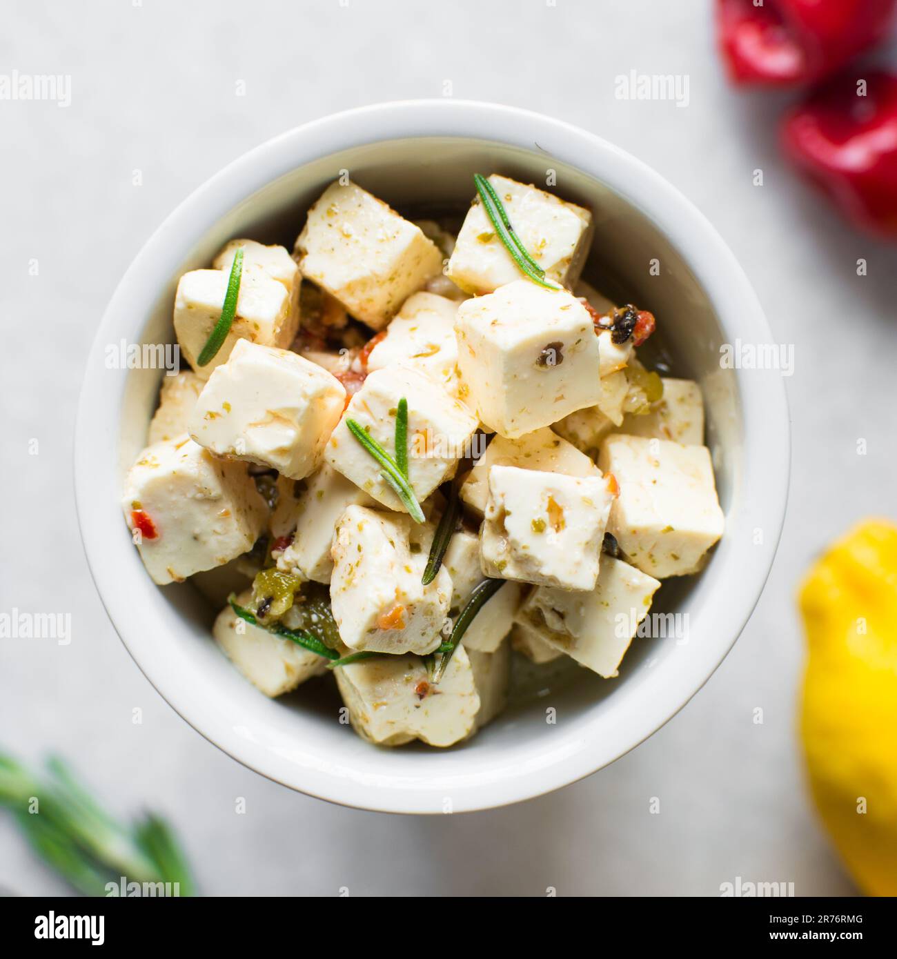 Top view of marinated feta cheese cubes in a ramekin, Cheese cubes ...
