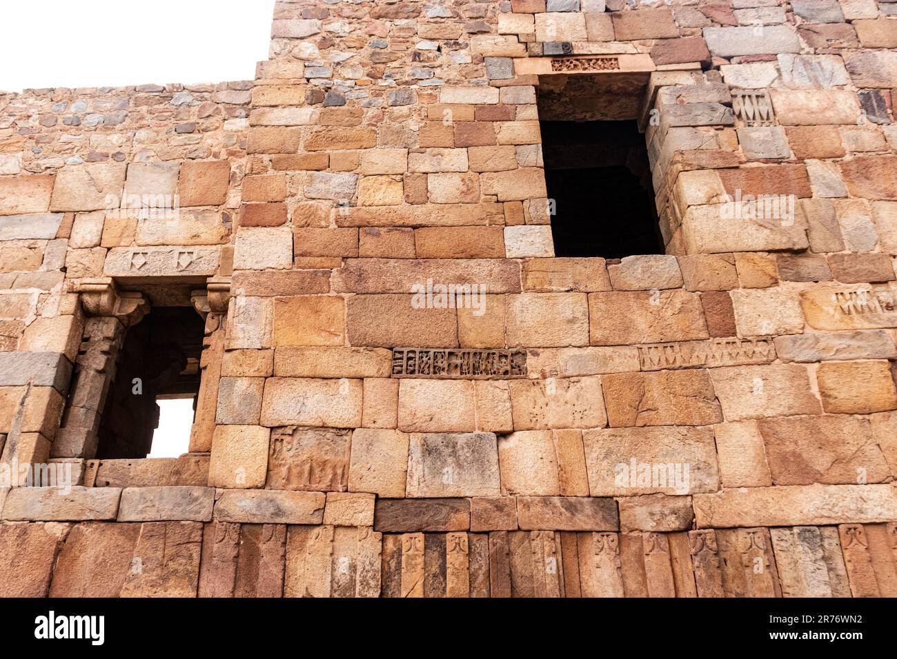 The wall of Quwwat-ul-Islam Mosque in Qutb Minar complex. Delhi, India ...