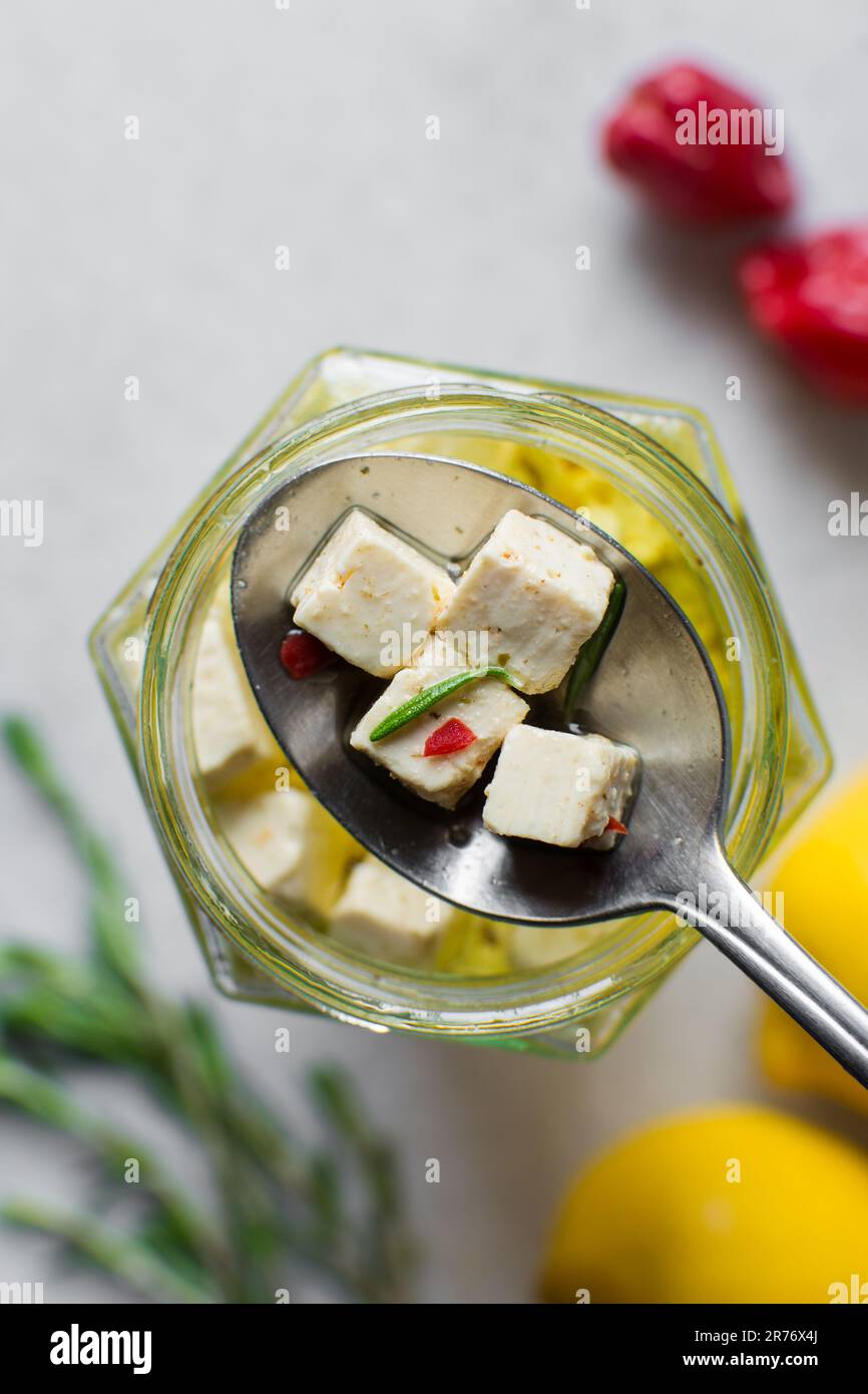 Top view of marinated feta cheese cubes in a spoon, Cheese cubes ...