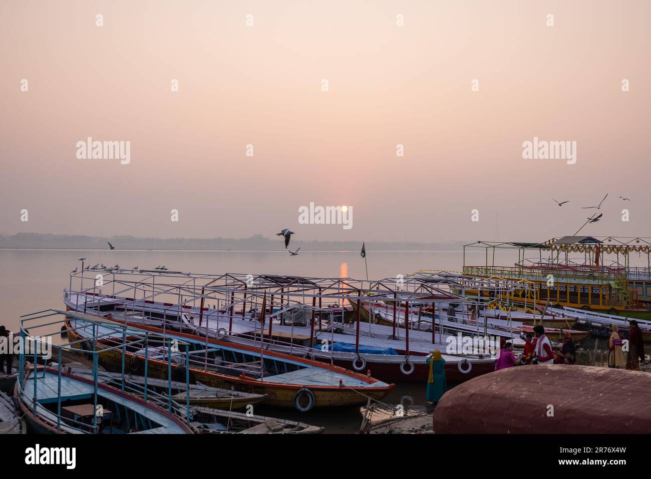 Varanasi: Boating in Varanasi, Wooden boats parked at river banks of ...
