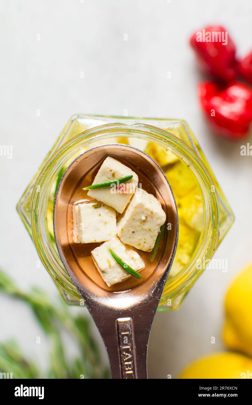 Top view of marinated feta cheese cubes in a spoon, Cheese cubes ...