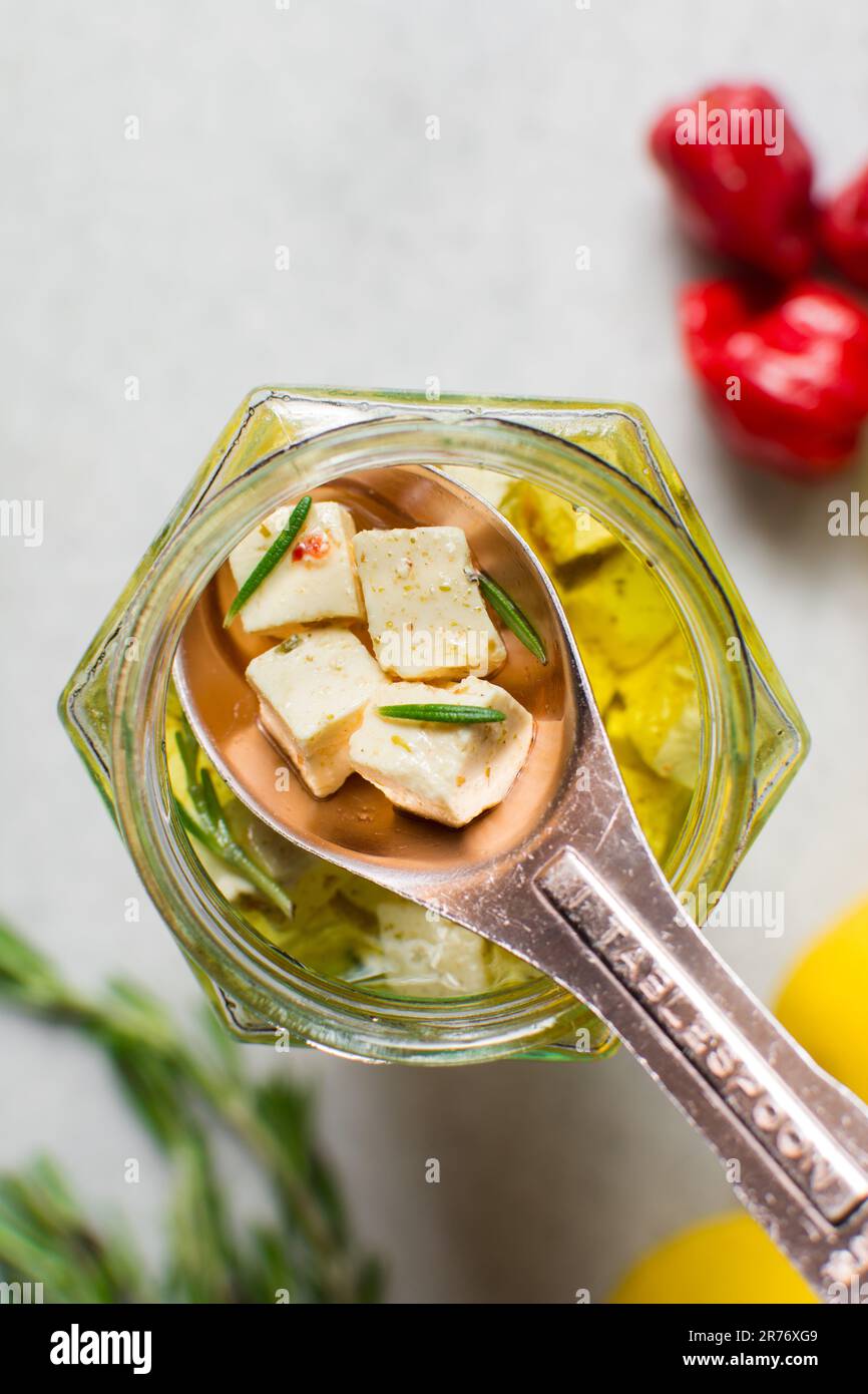 Top view of marinated feta cheese cubes in a spoon, Cheese cubes ...