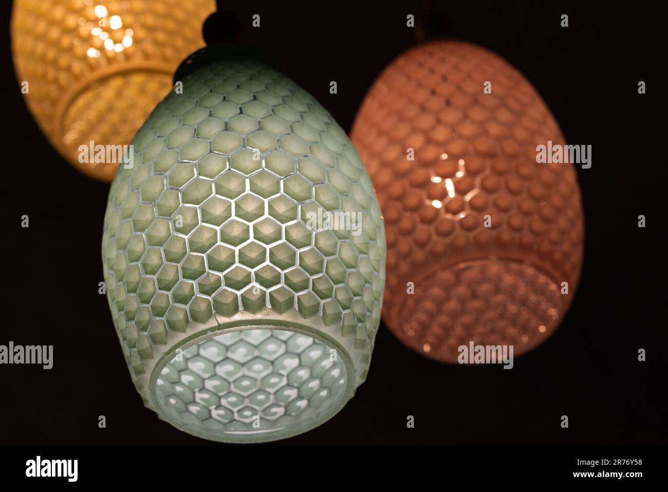 Modern chandelier with colorful glass lamp shades, close up photo with ...