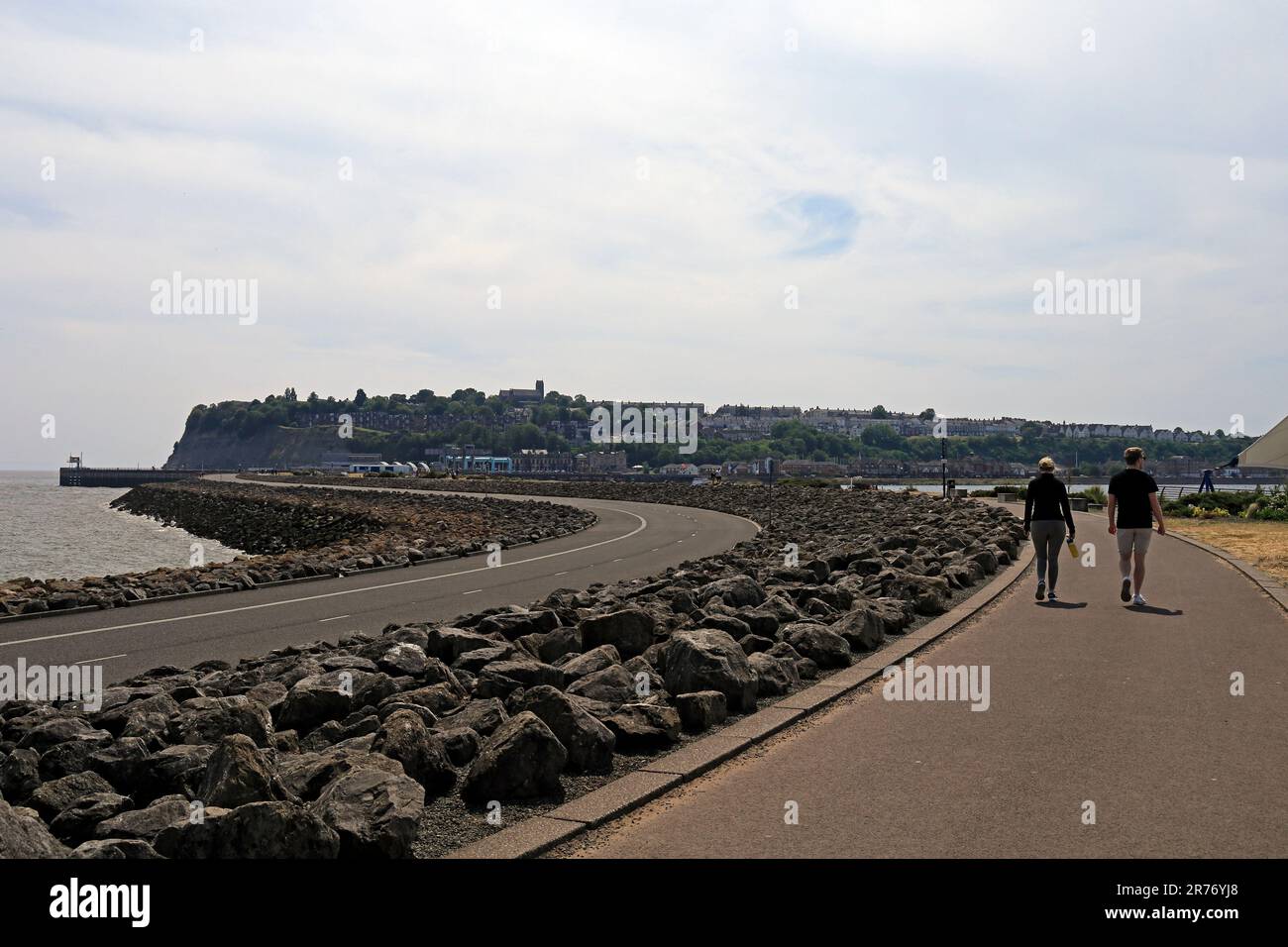 Young couple walking along Cardiff Bay Barrage, . June 2023. Summer ...