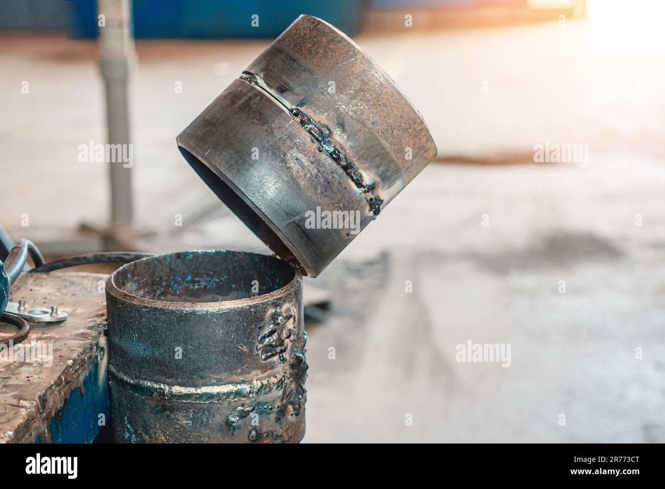 Simulator for practicing welding of metal pipes. Welded seam on metal ...