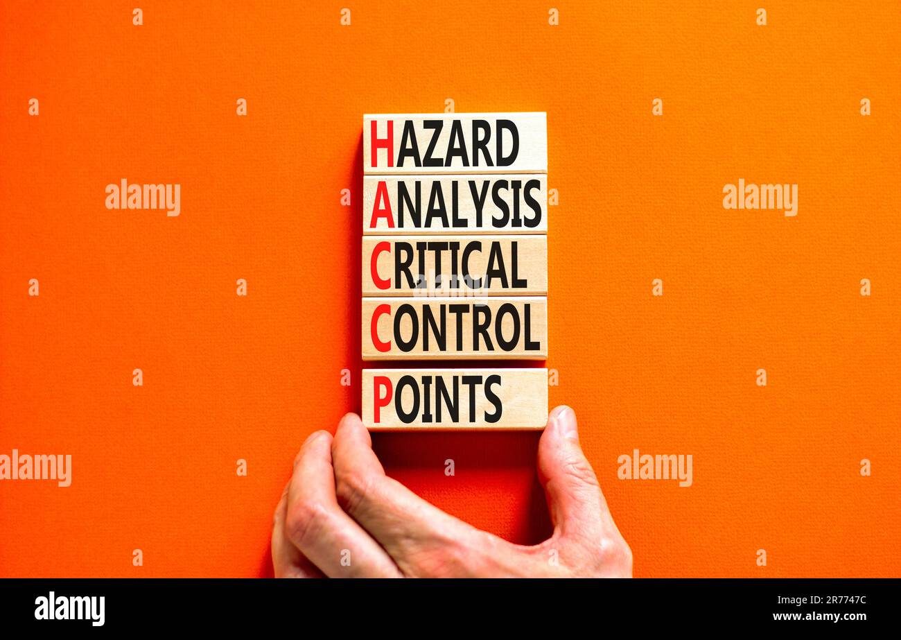 HACCP symbol. Concept words HACCP hazard analysis critical control point on wooden block ...