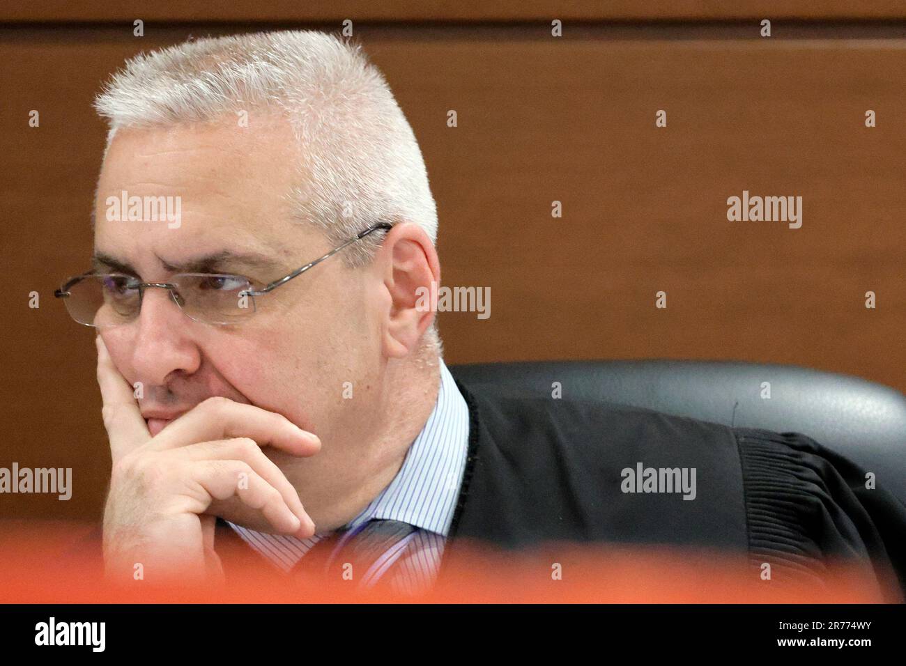 Judge Martin Fein looks at a witness during testimony during the trial ...