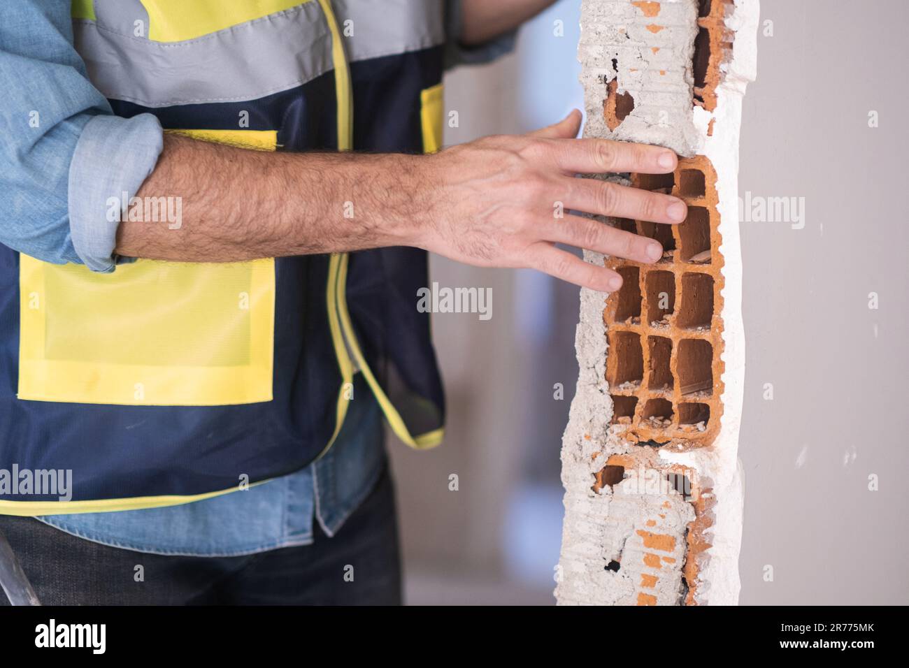 Engineer checking wall material safety for construction condition and ...